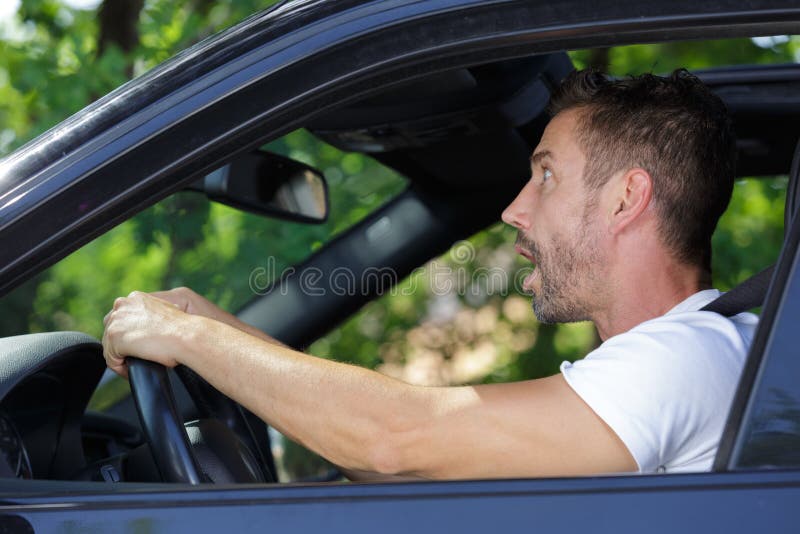 Side View Man Driving Car with Shocked Expression Stock Image - Image ...