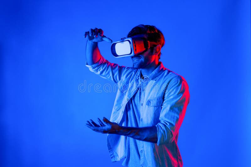 Side View of Man Holding and Moving Gesture while Using VR Goggle ...