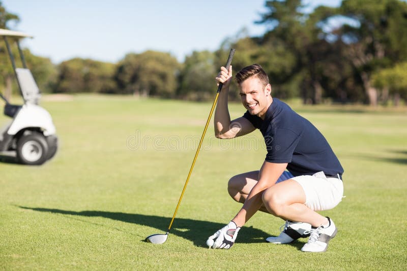 Side View of Man Placing Golf Ball on Tee Stock Image - Image of focus ...