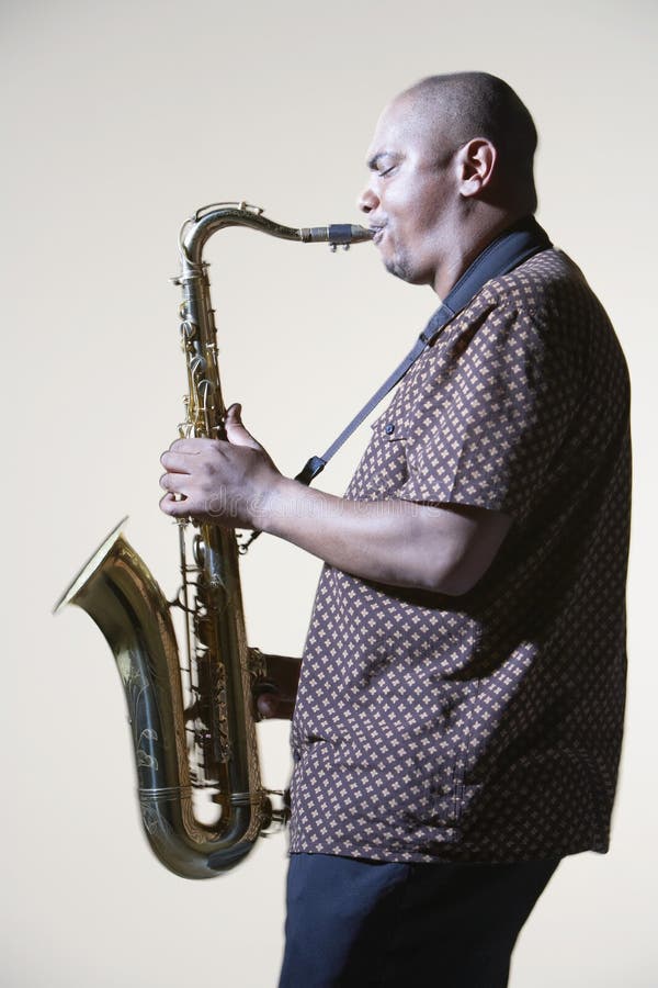 Side View of Man Playing Saxophone Stock Photo - Image of casual ...