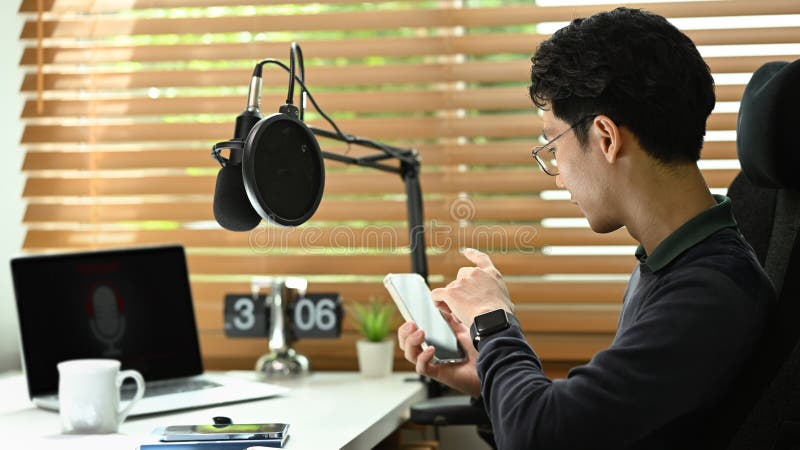 Side View of Man Radio Host Sitting Front of Condenser Microphone and ...