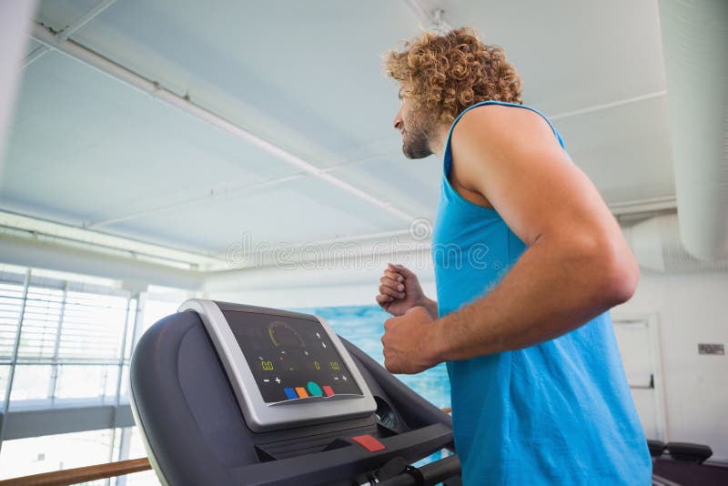 Side View of Man Running on Treadmill in Gym Stock Photo - Image of ...
