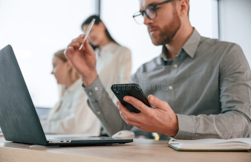 Side View of Man that is Sitting. Successful Team are Working Together ...