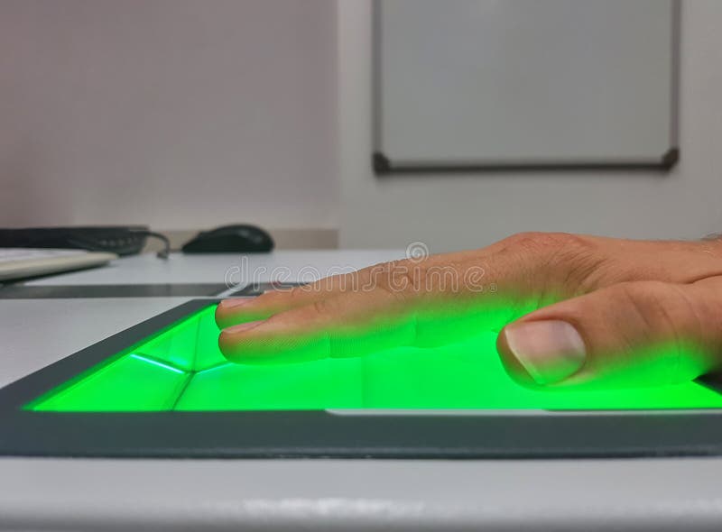 Side View from a Man Using a Fingerprint Scanner for Identification ...