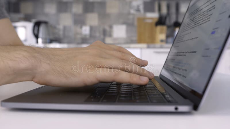 Side View of a Man Using Laptop and Typing on Keyboard. Action. Close ...