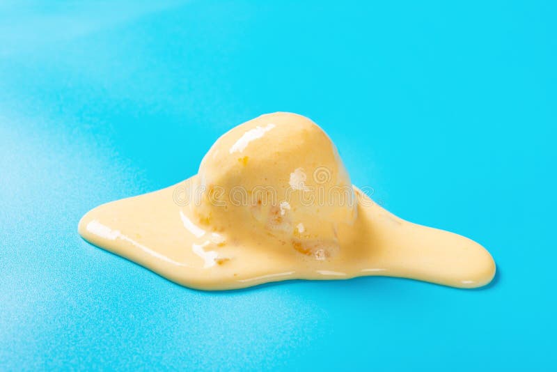 Mango Flavor Ice Cream Ball in a Melting Process on Blue Background ...