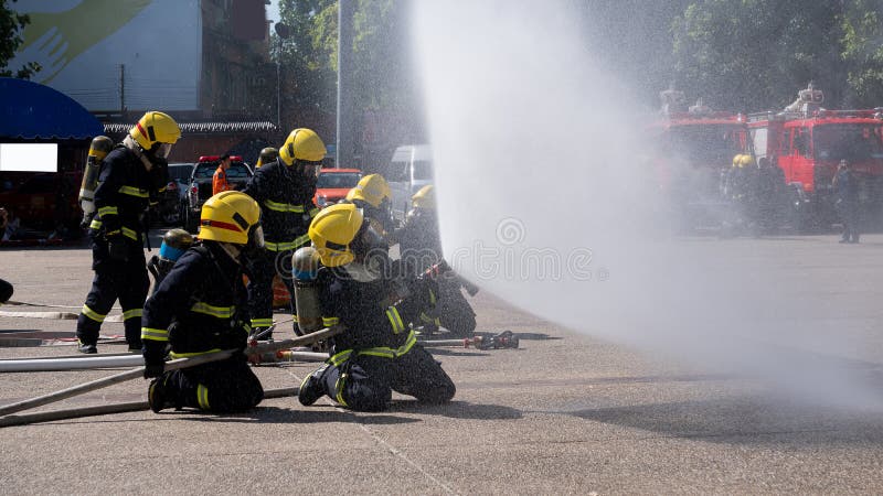 A Side View of Many Firefighters is Practicing Using Editorial Stock ...