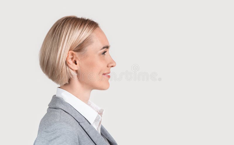 Side View of Mature Business Lady on Light Studio Background, Space for ...