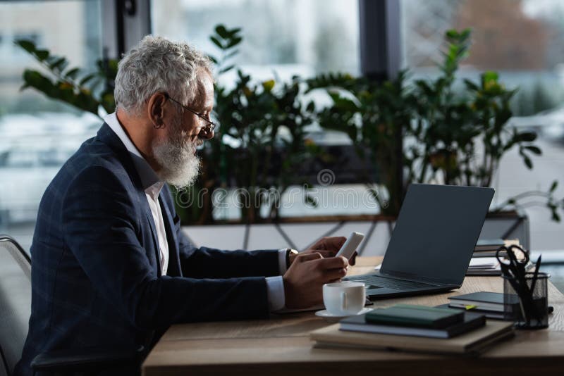 Side View of Mature Manager Using Stock Image - Image of documents ...