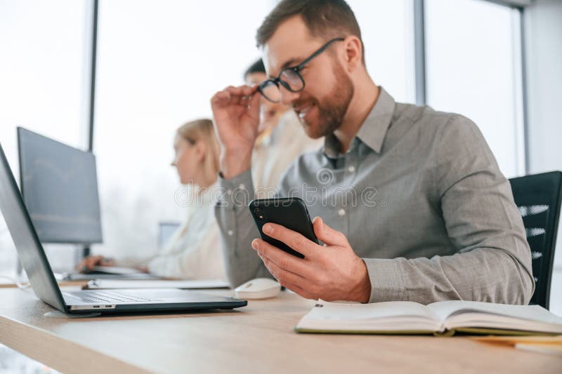 Side View of Man that is Sitting. Successful Team are Working Together ...