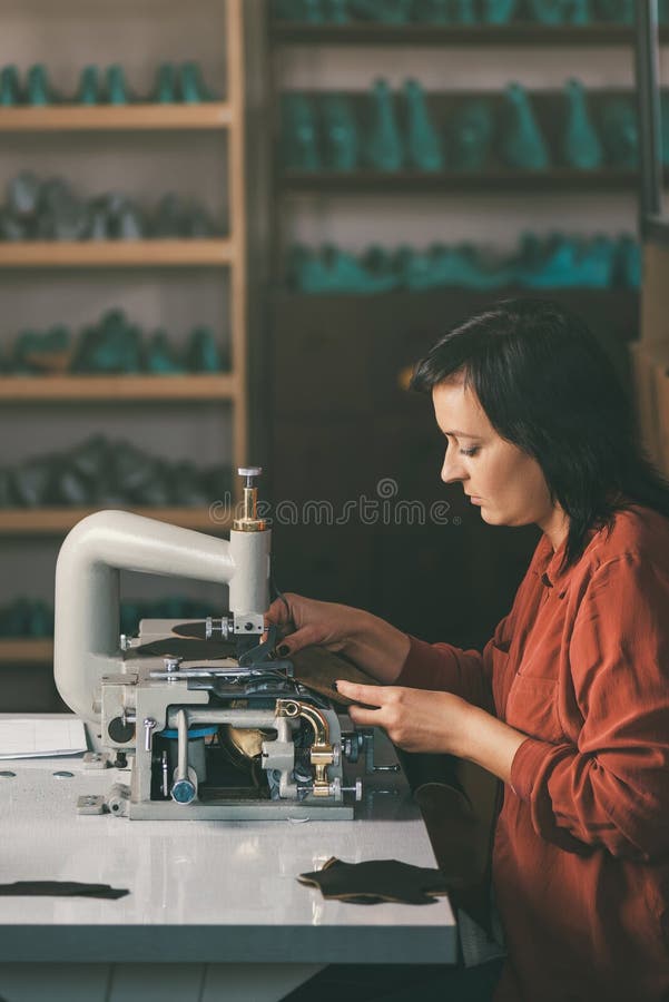 Side View of Middle Aged Seamstress Working with Sewing Machine and ...