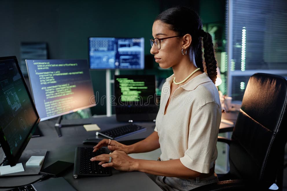 Focused Female it Programmer with Glasses Using Computer Writing Code ...