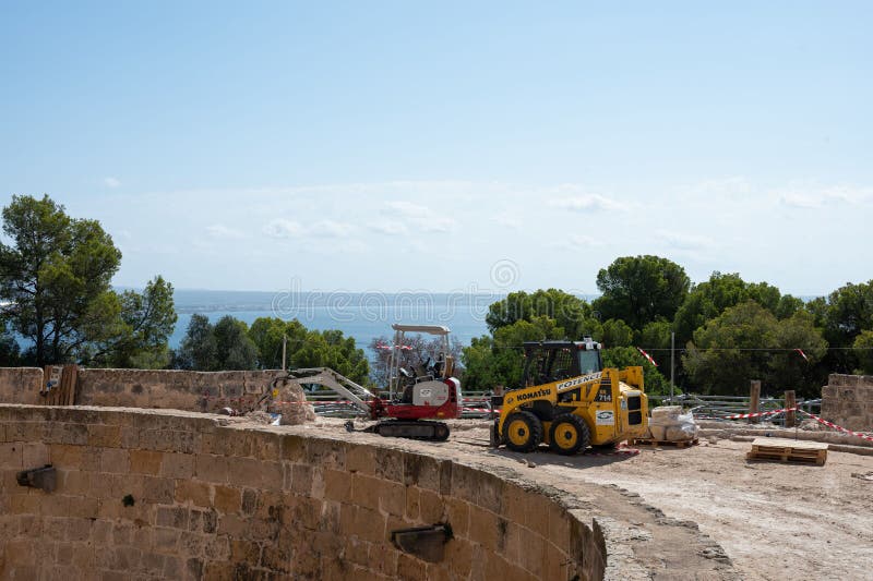 Side View of a Mini Excavator and a Skid Steer Loader at the ...