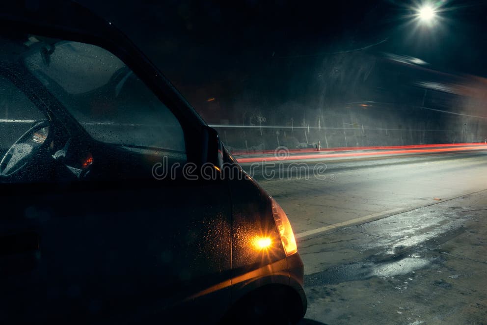 Side View of a Minivan in the Tunnel at Night with Headlights on Stock ...