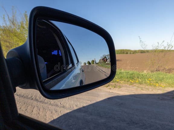 A Side View Mirror of a Car on the Side of a Road Stock Image - Image ...