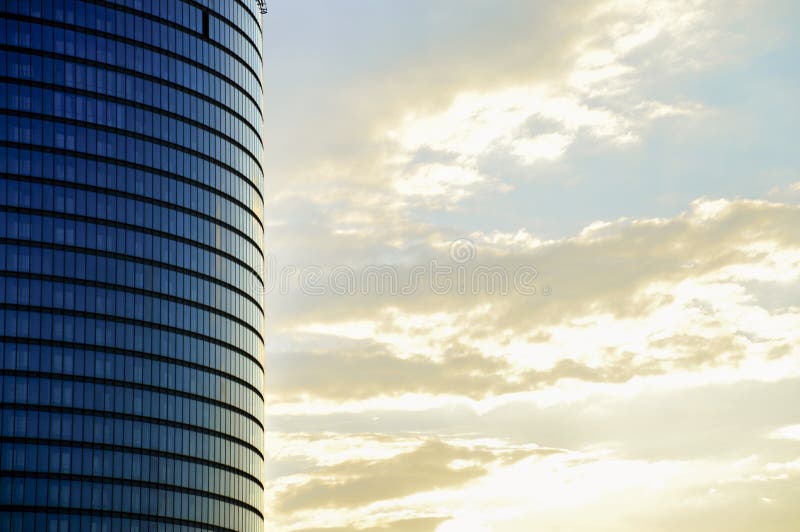 Side View of the Modern Glass Skyscraper Facade on the Late Sunrise Sky ...