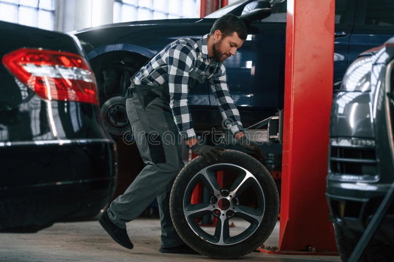 Side View. Moving the Tire for the Car Stock Image - Image of wear ...