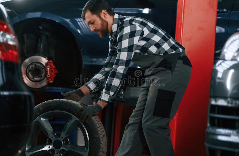 Side View. Moving the Tire for the Car Stock Image - Image of mature ...