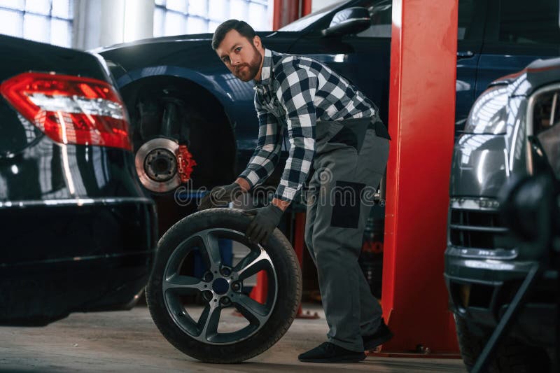 Side View. Moving the Tire for the Car Stock Photo - Image of interior ...