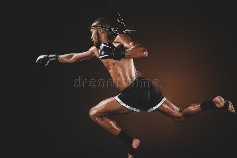 Side View of Muay Thai Fighter in Boxing Gloves Practicing Punch Stock ...