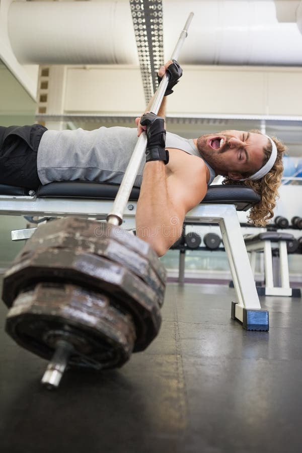 Side View of Muscular Man with Barbell in Gym Stock Photo - Image of ...