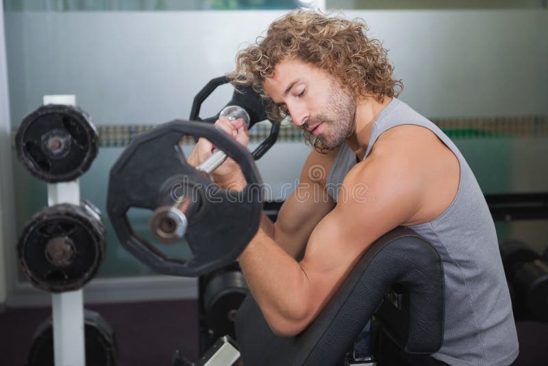 Side View of Muscular Man Lifting Barbell in Gym Stock Photo - Image of ...