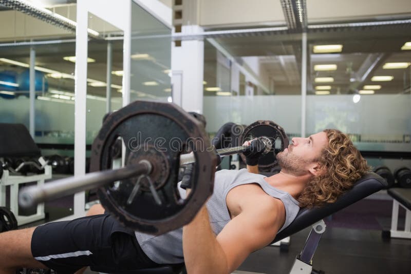 Side View of Muscular Man Lifting Barbell in Gym Stock Image - Image of ...