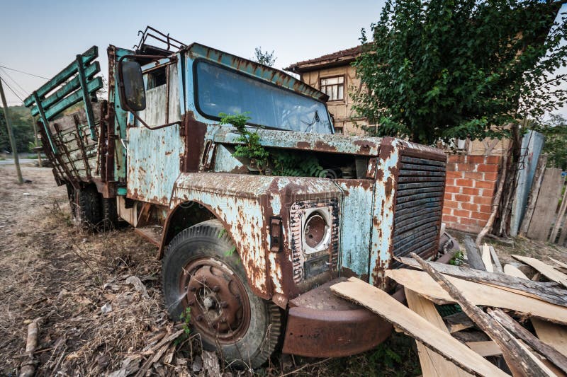 Side View of an Old Blue Truck Left To Rust in a Village Environment ...