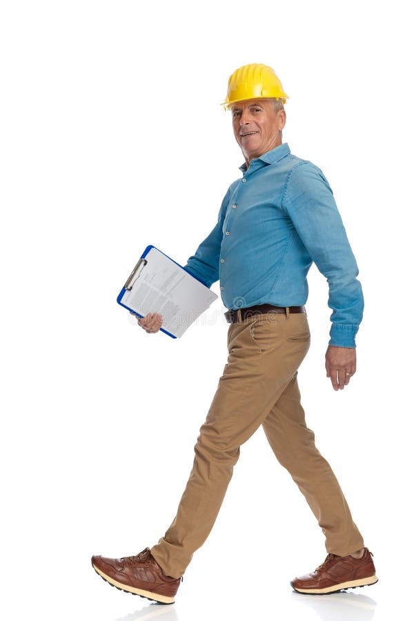 Side View of Old Engineer with Safety Helmet and Clipboard Smiling and ...