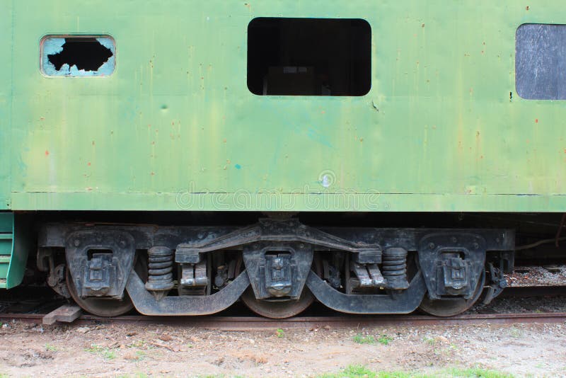Side View of an Old Green Train Passenger Car with a Broken Window ...