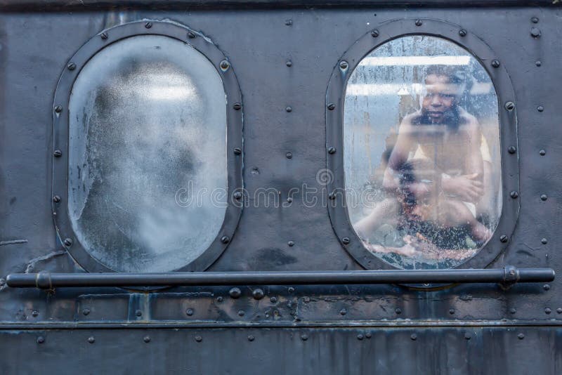Side View of Old Train Cabin Window with Reflection of Two Children ...