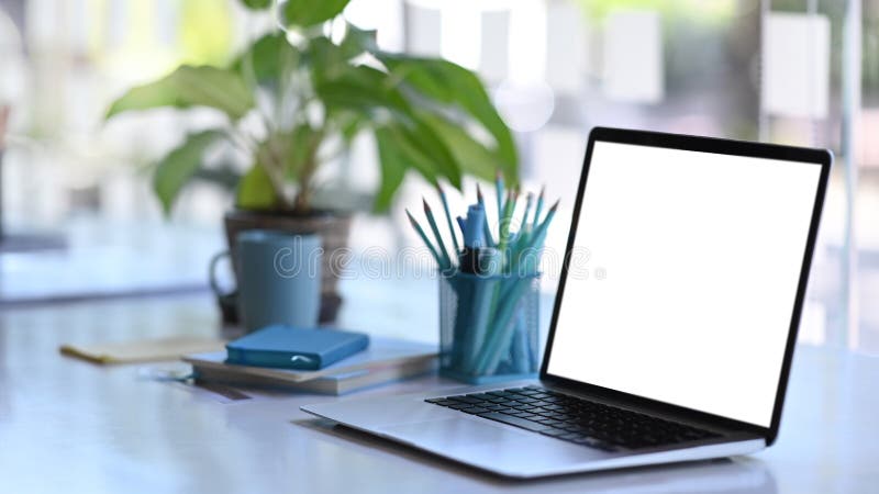 A Laptop Computer with White Screen on Creative Designer Workspace ... A Laptop Computer with White Screen on Creative Designer Workspace ...