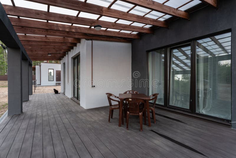 Side View of an Open Veranda in Front of a Modern Forest Cottage. Pine ...