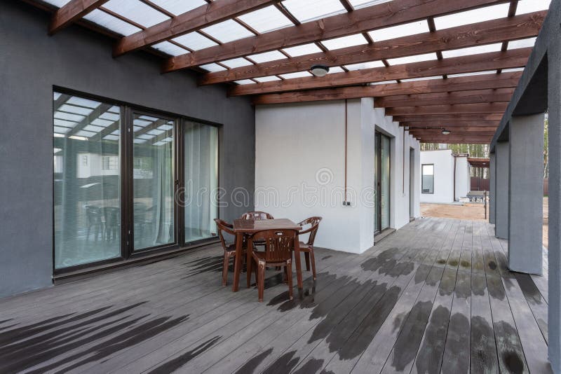 Side View of an Open Veranda in Front of a Modern Forest Cottage. Pine ...
