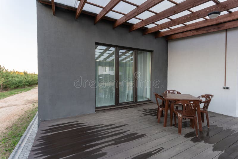 Side View of an Open Veranda in Front of a Modern Forest Cottage. Pine ...