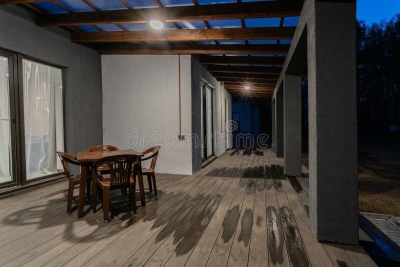 Side View of an Open Veranda in Front of a Modern Forest Cottage. Pine ...