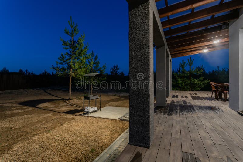 Side View of an Open Veranda in Front of a Modern Forest Cottage. Pine ...