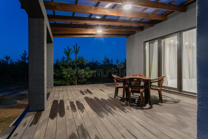 Side View of an Open Veranda in Front of a Modern Forest Cottage. Pine ...