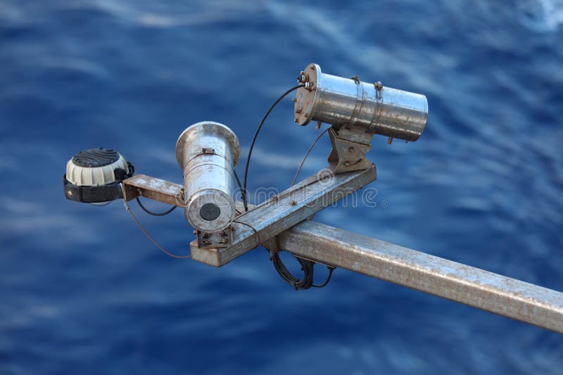 Side View of an Outdoor Mounted Security Camera with Sky, Clouds and ...