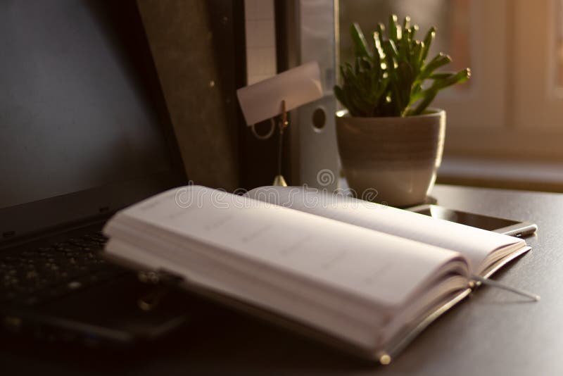 Side View Paper Notebook and Laptop. Concept for Working in the Evening ...