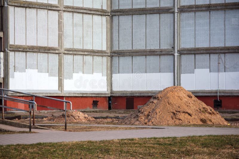 Side View of a Partially Demolished Multi-story Building with a Large ...