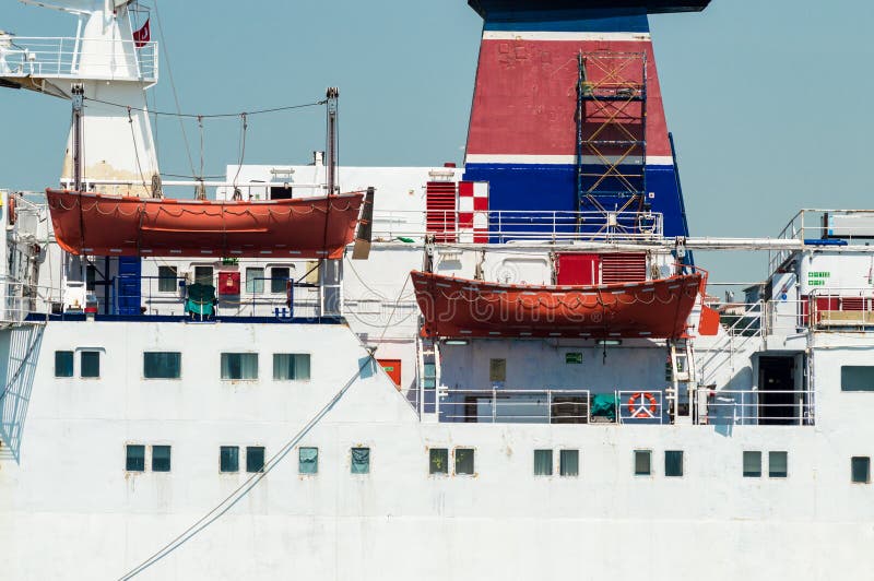 Side View of a Passenger Ship and Orange Lifeboats Stock Photo - Image ...