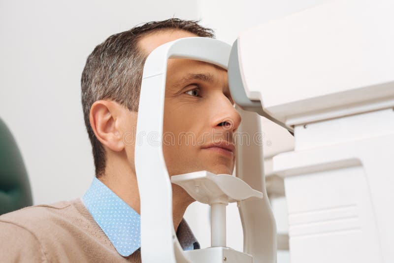 Side View of Patient Getting Eye Checked Stock Image - Image of clothes ...