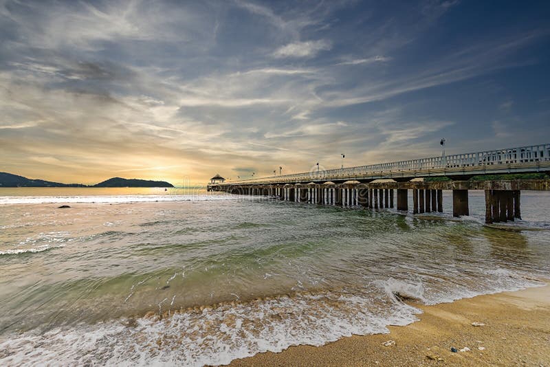 Side View of Pier at the Beach at Sunset Time.Thailand Stock Image ...
