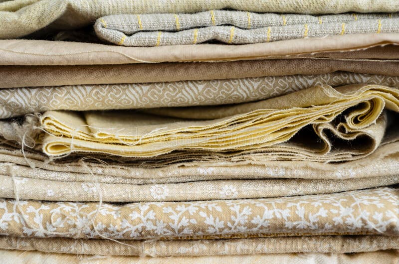 Side View of a Pile of Folded Brown Fabric Pieces Stock Photo - Image ...