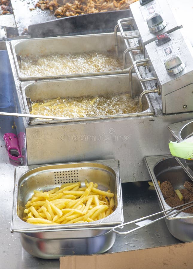 Chips Being Cooked in Deep Fryers. Stock Image - Image of potato ...