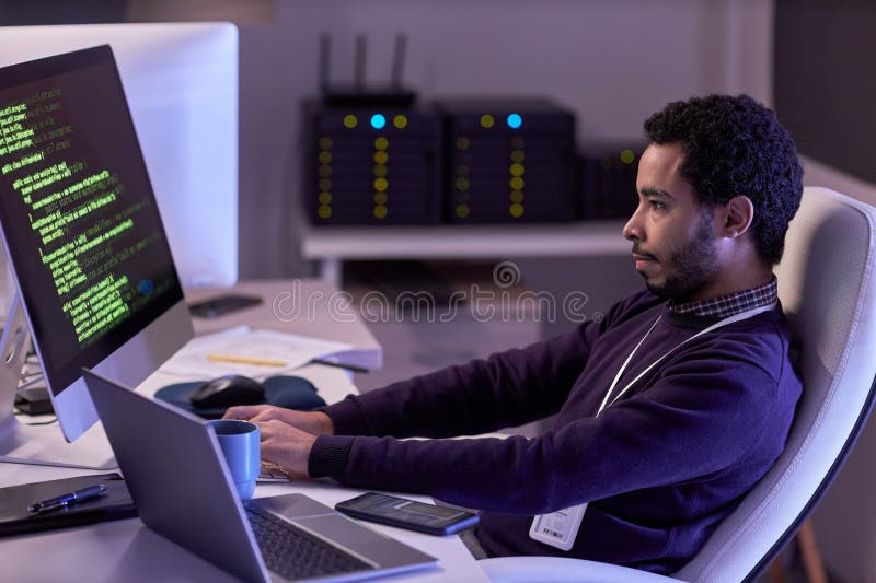 Bearded Man Using Computers and Writing Code in Neon Light Stock Photo ...