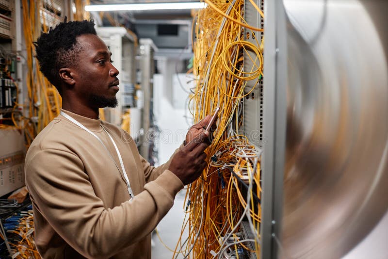 System Administrator Setting Up Server and Using Smartphone Stock Photo ... System Administrator Setting Up Server and Using Smartphone Stock Photo ...