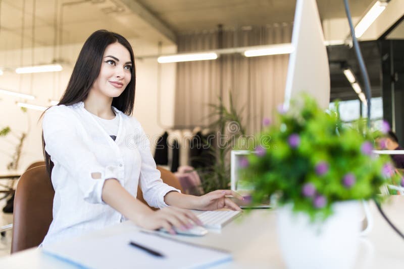 Side View Portrait of Businesswoman Using Computer at Office Desk Stock ...