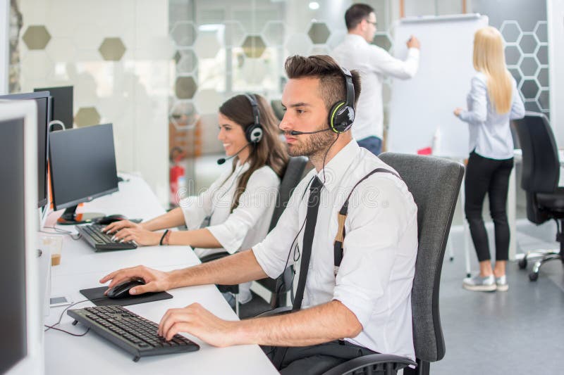 Side View Portrait of Handsome Man with Headset Working in Office ...
